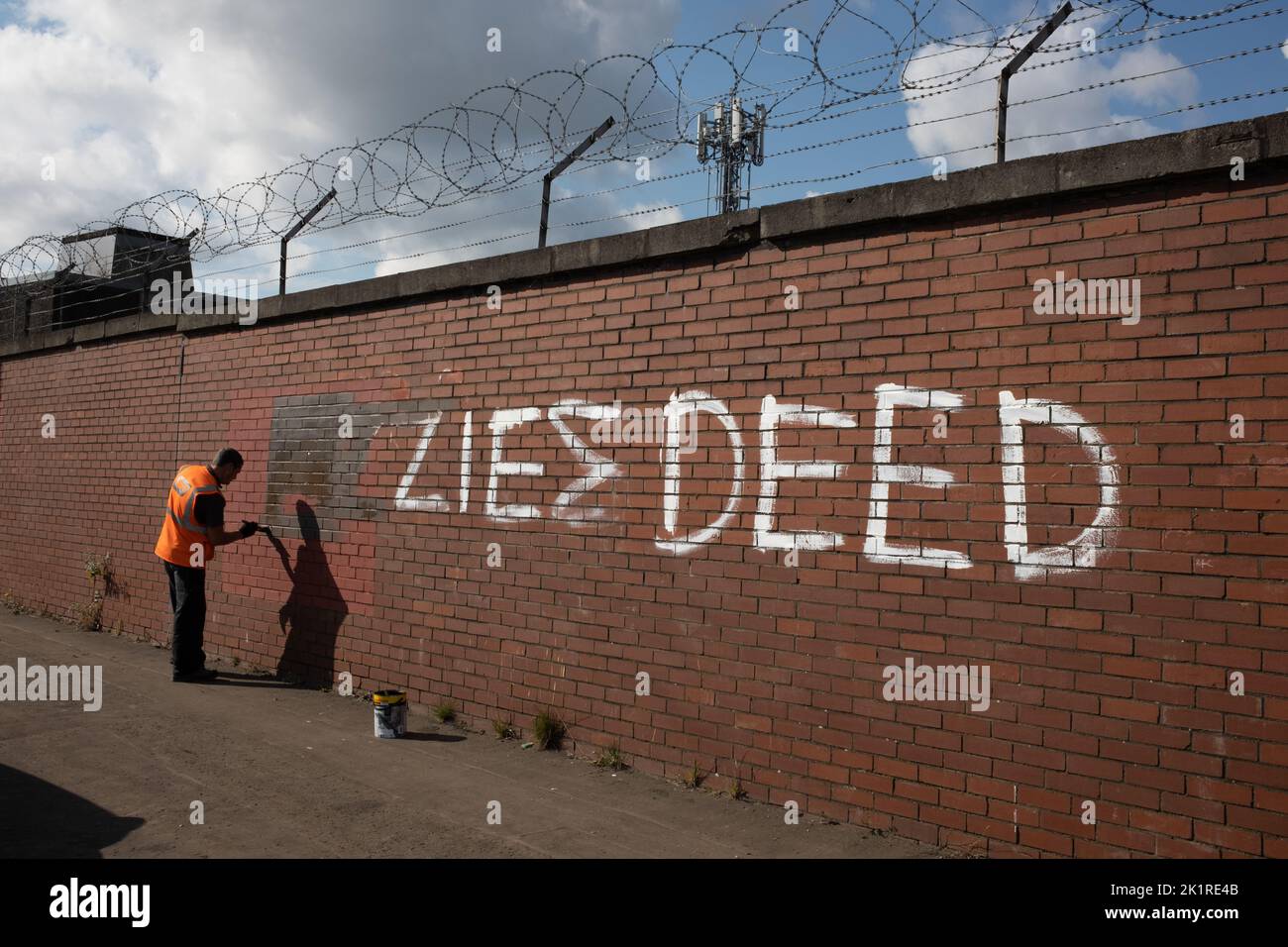 Glasgow Scotland, 20 September 2022. A transport worker paints over ...