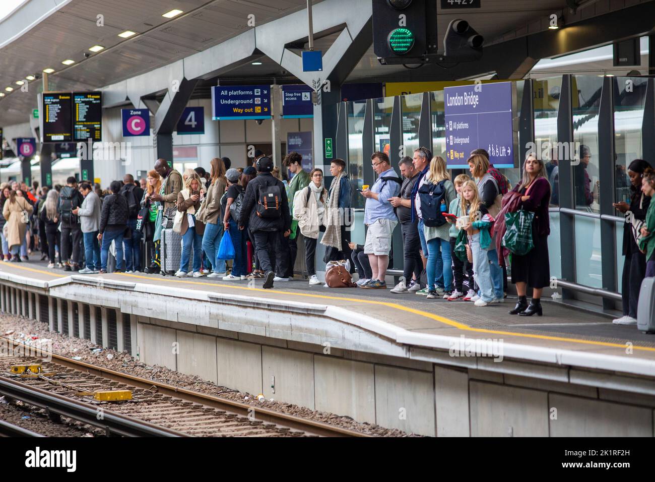 People travel through London Bridge train station on their way to show ...