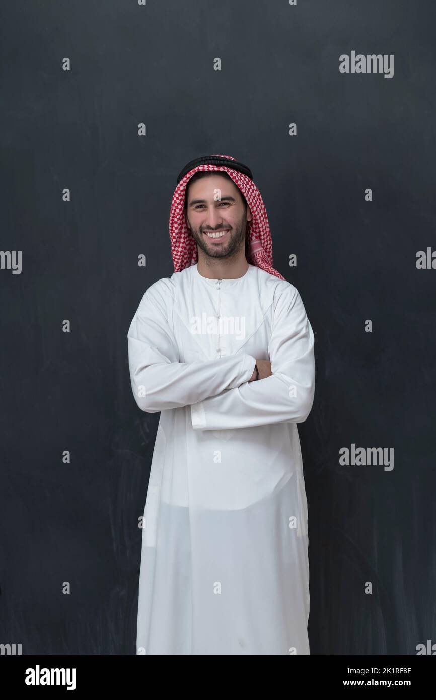 Portrait of young muslim man wearing traditional clothes Stock Photo ...