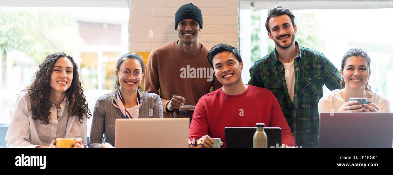 Horizontal banner or header with smiling multiethnic coworkers looking ...