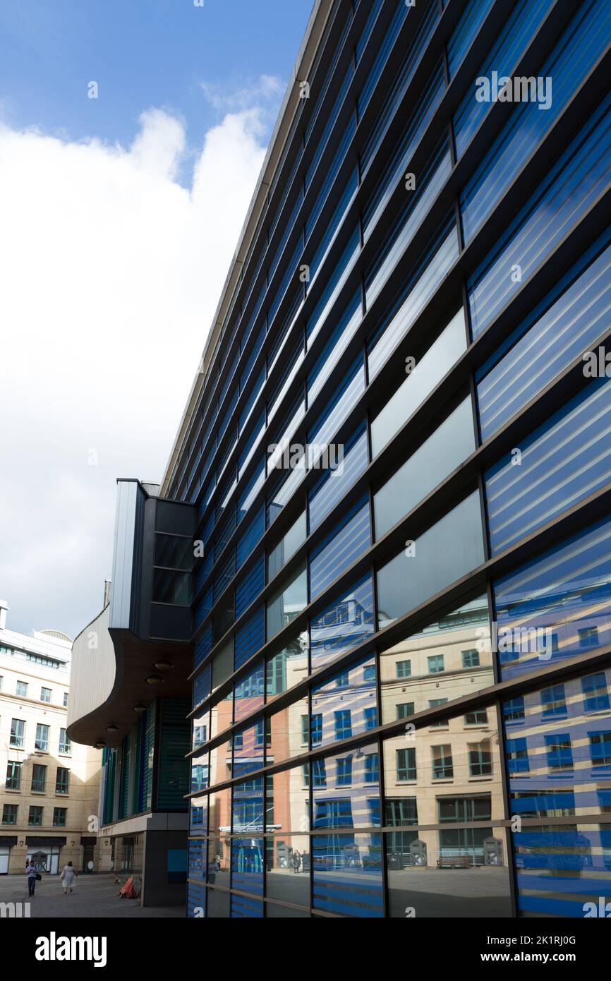 Exchange Crescent buildings reflected in modern glass building ...