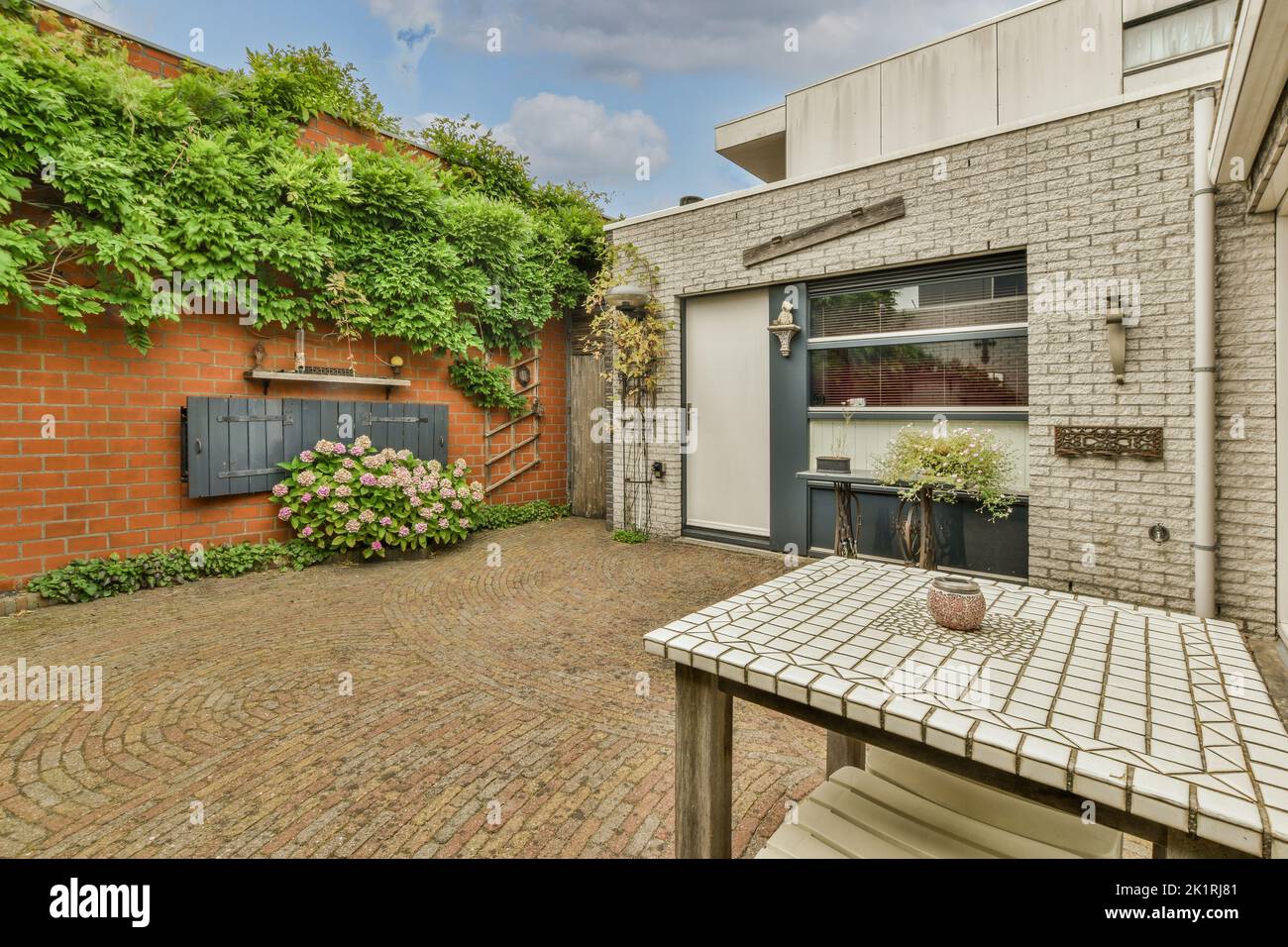 Simple small patio with small garden Stock Photo - Alamy