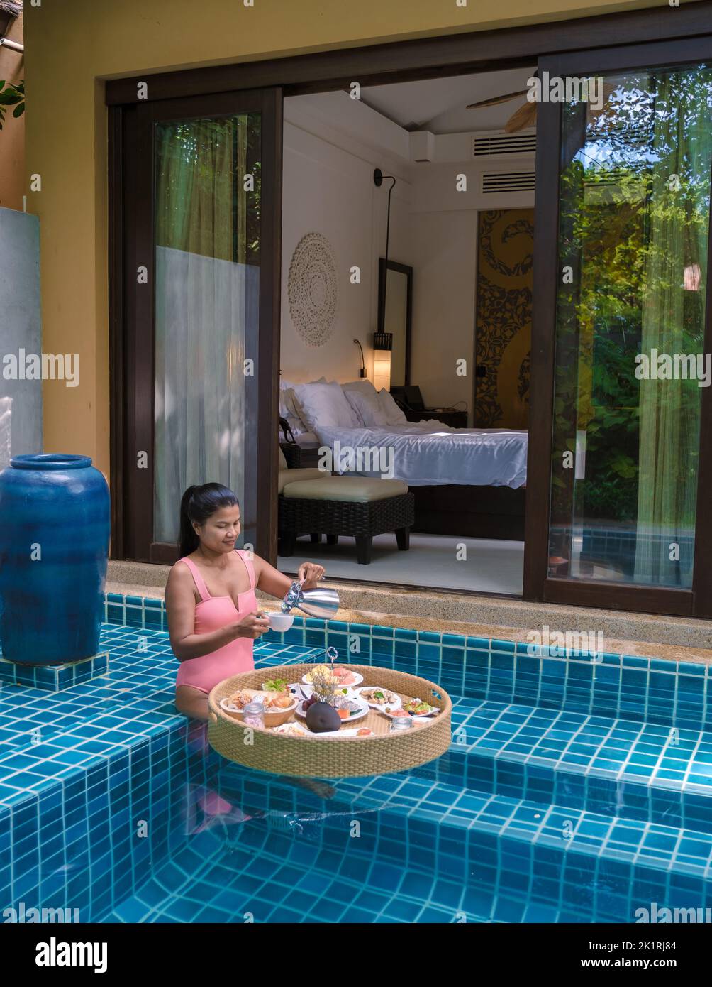 A women having breakfast in the swimming pool, Asian women having ...