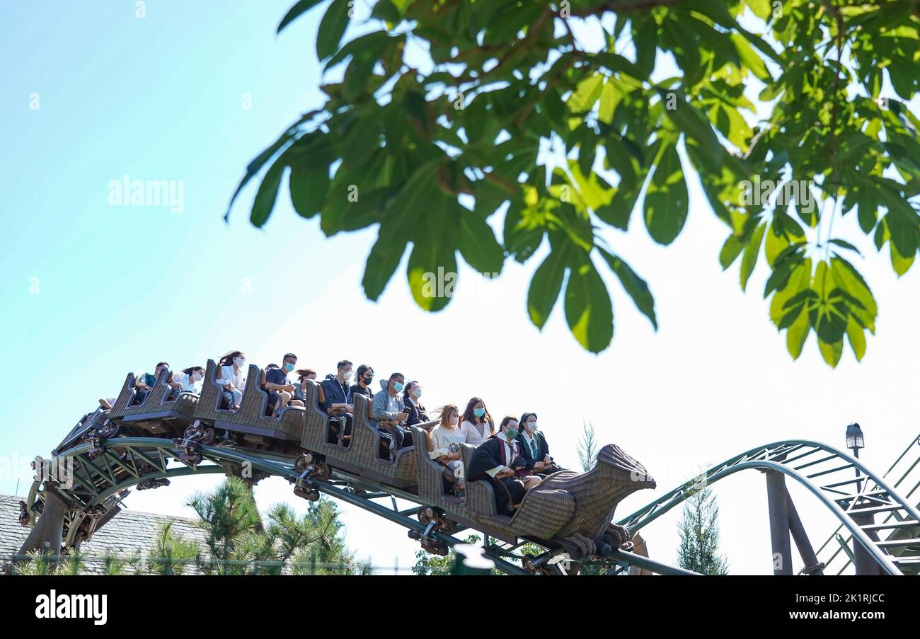 Beijing, China. 20th Sep, 2022. Visitors take a roller coaster at the ...
