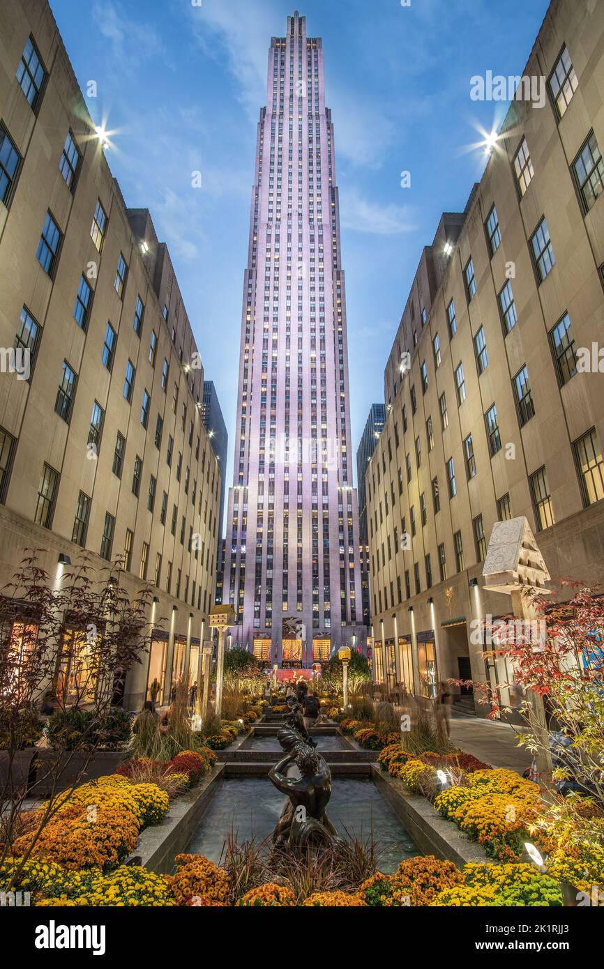 The illuminated Rockefeller Plaza decorated for fall with a tower in ...