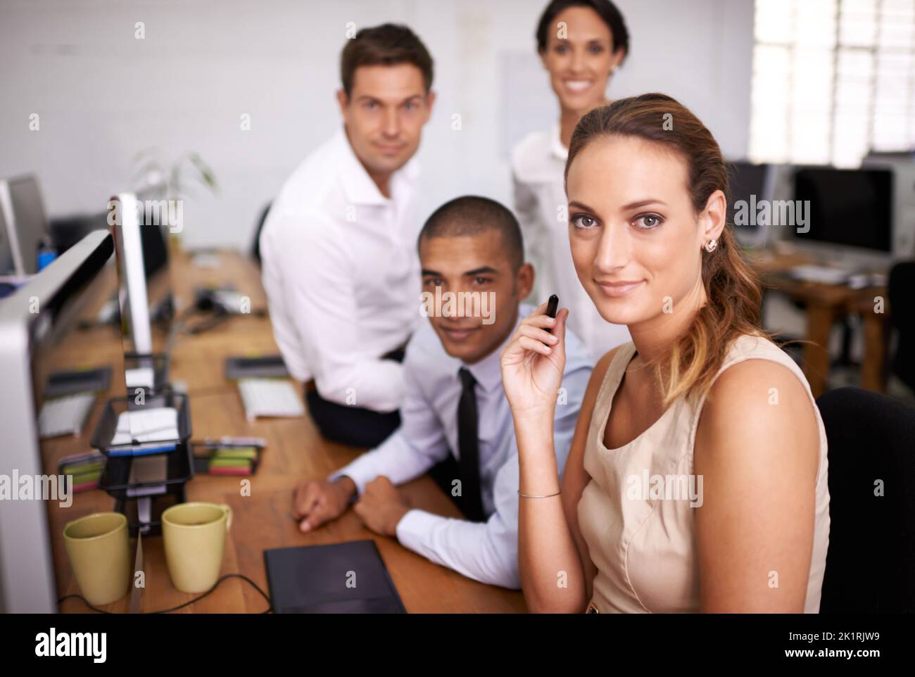 We make teamwork look easy. Portrait of a happy business team working ...