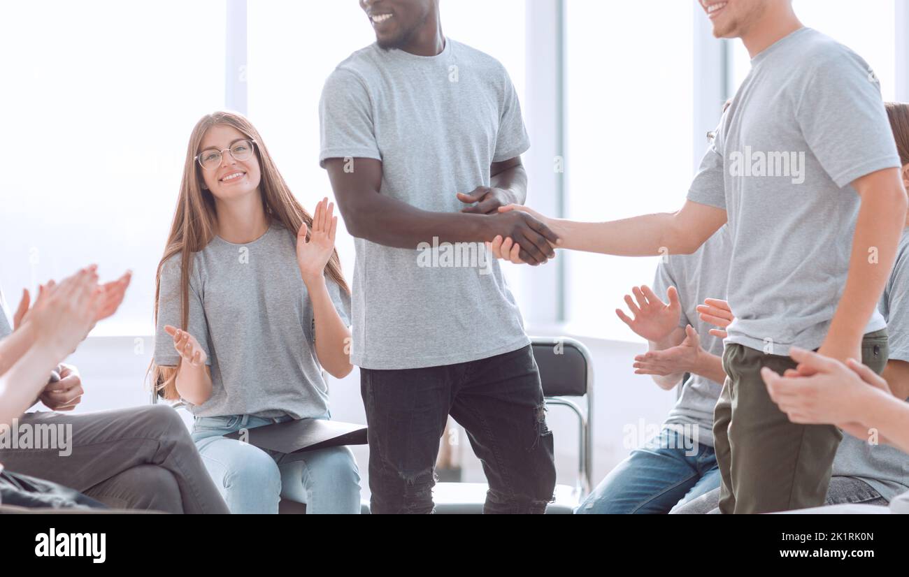 Friends shaking hands students hi-res stock photography and images - Alamy