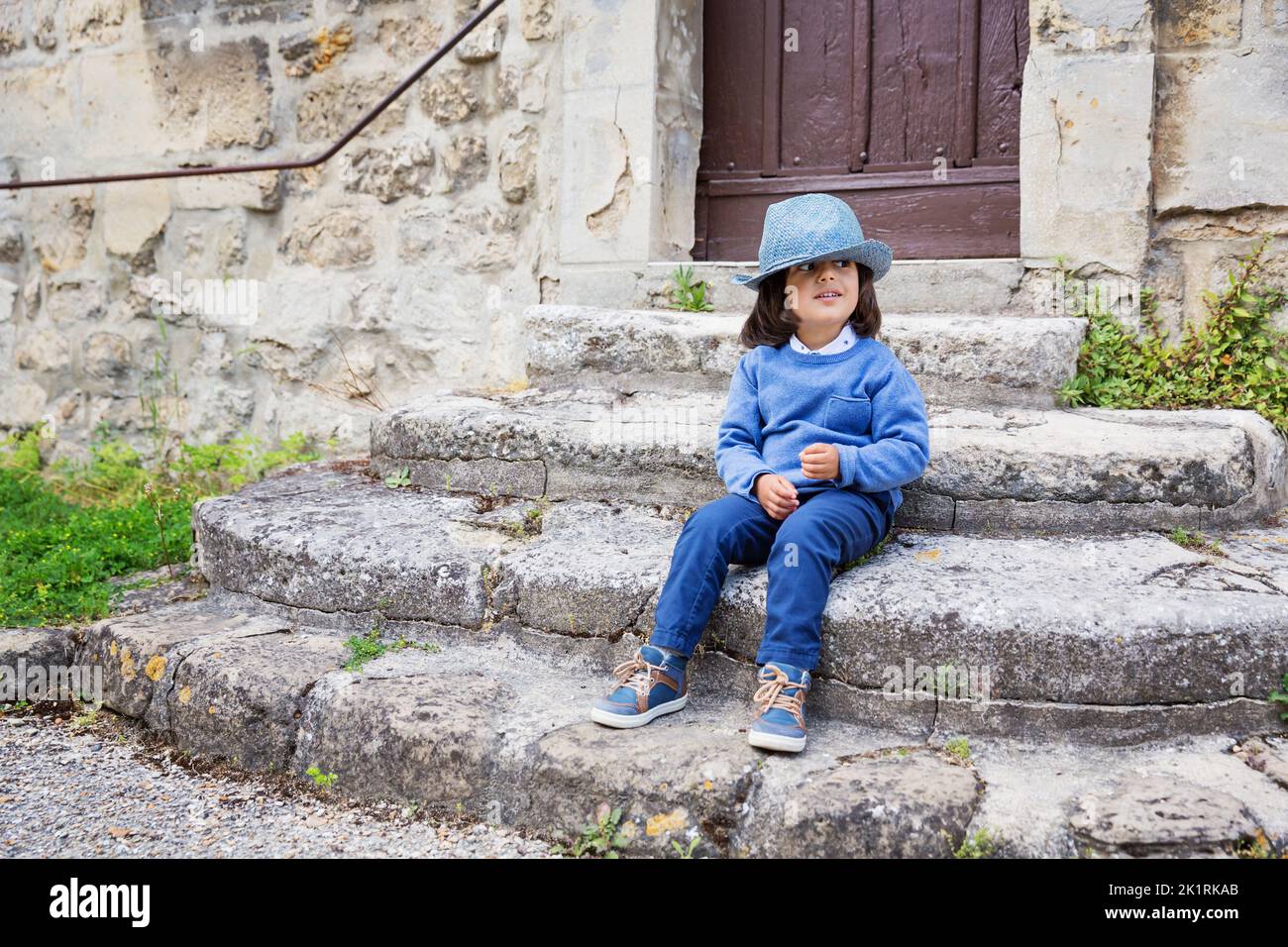 Little boy on stairs hi-res stock photography and images - Alamy
