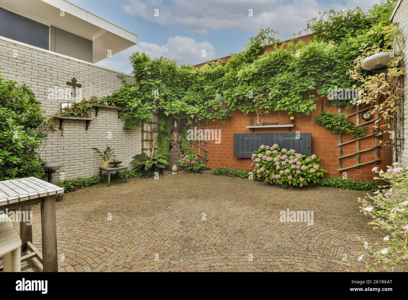 Simple small patio with small garden Stock Photo - Alamy