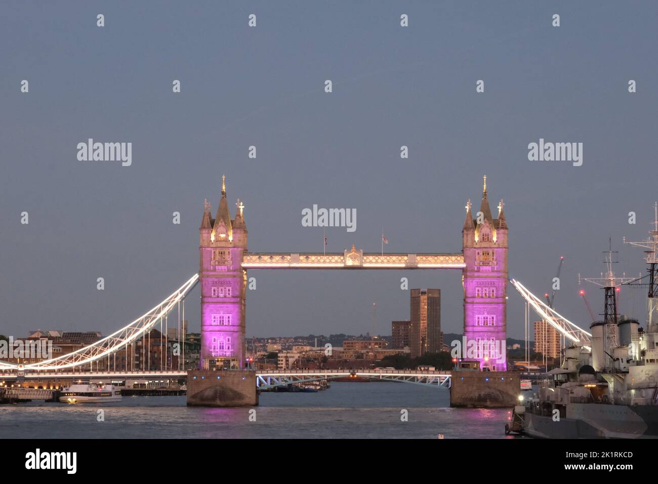 London Tower Bridge with pink and purple lights on because of Queen ...