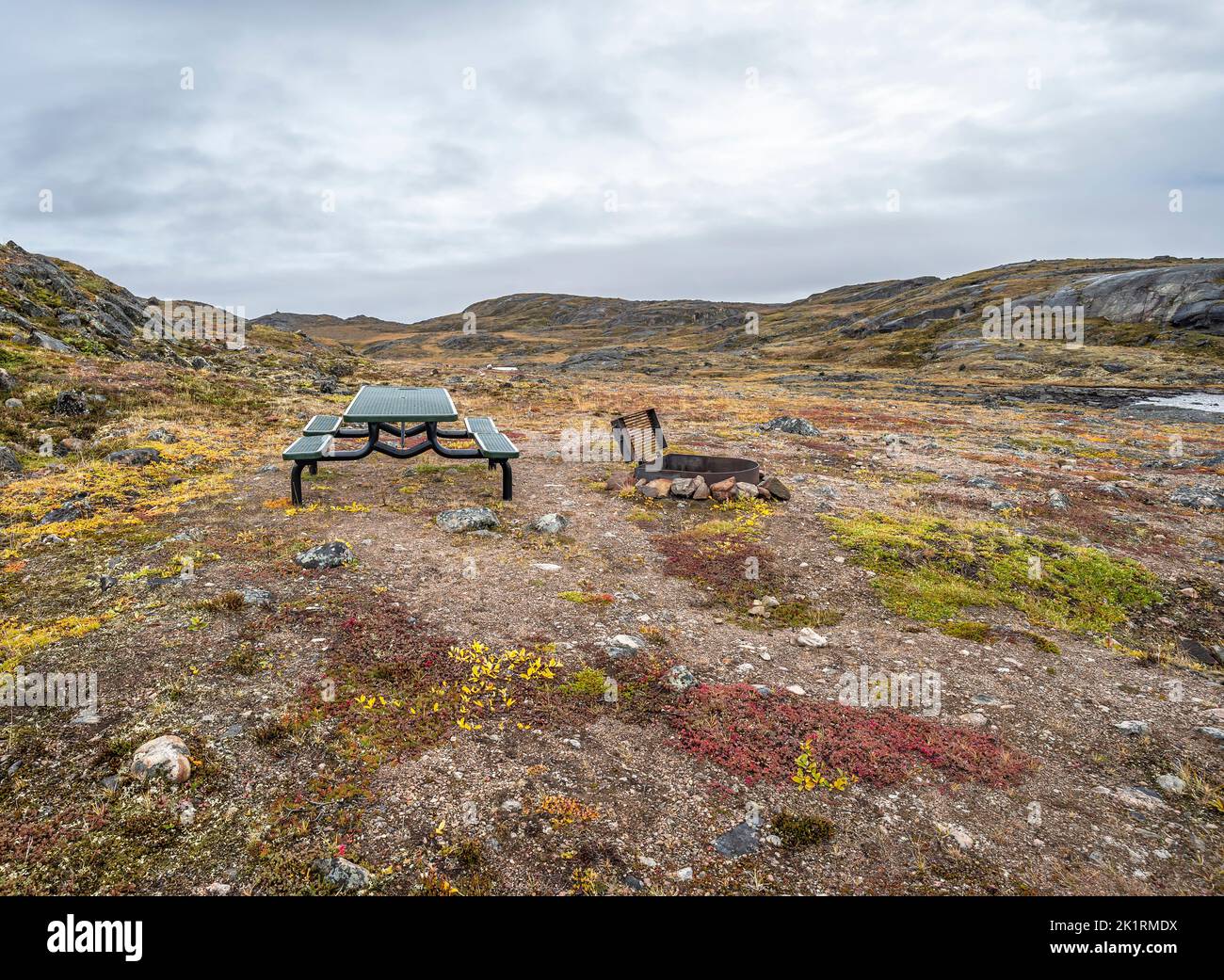 View of a picnic table and grill on the tundra at Sylvia Grinnell ...