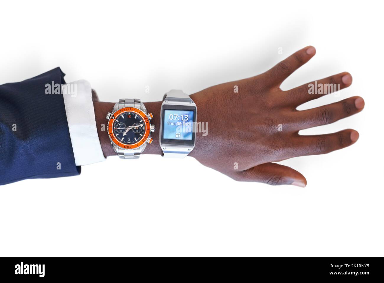 Breaking tradition. Studio shot of an arm wearing a smart watch and an ...
