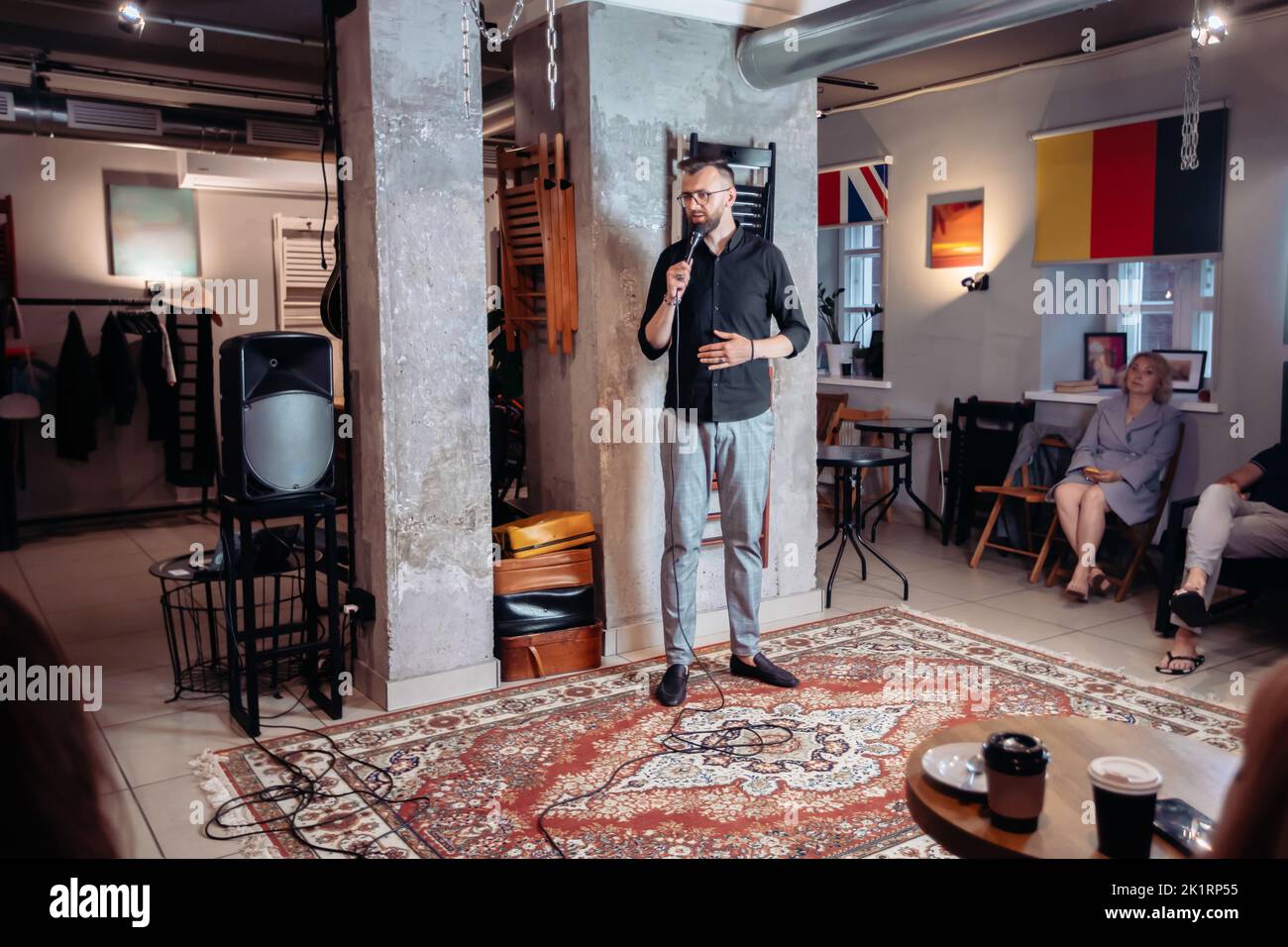 young businessman with a microphone at a public speaking training Stock ...