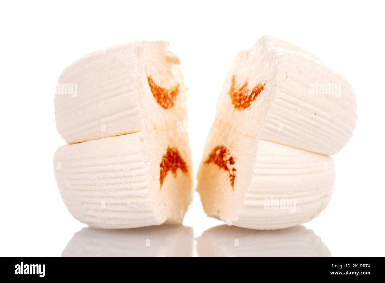 One white sweet marshmallow cut in half, macro, isolated on white ...