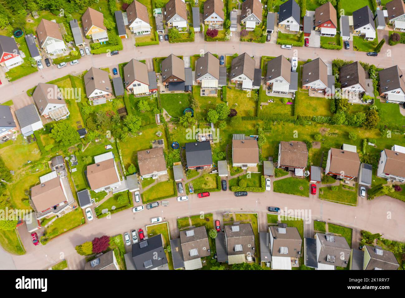 A bird's eye view of residential houses surrounded by forests Stock ...