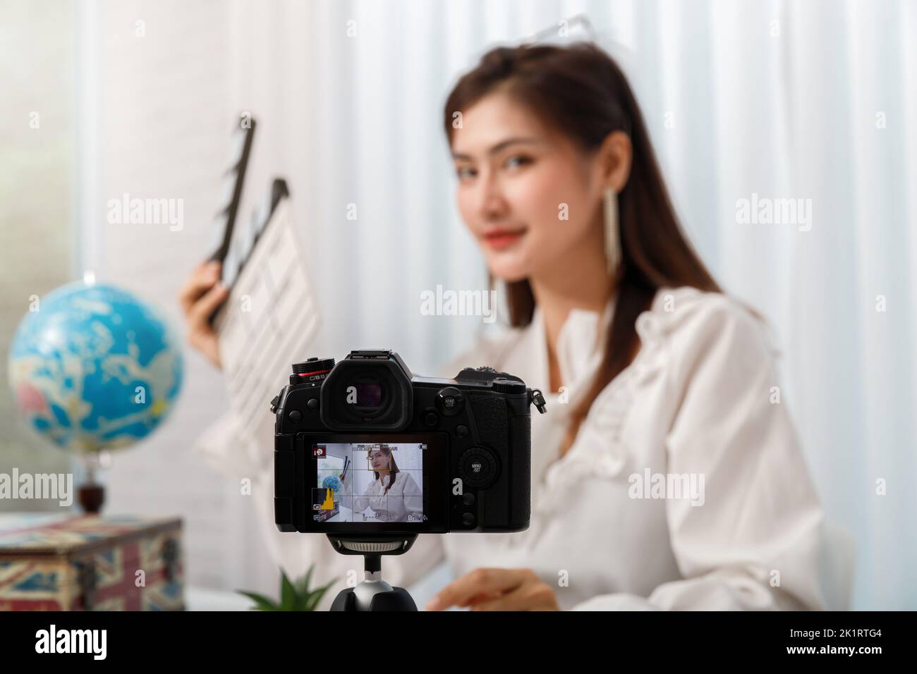 Young asian woman traveler blogger selfie herself with smart phone ...