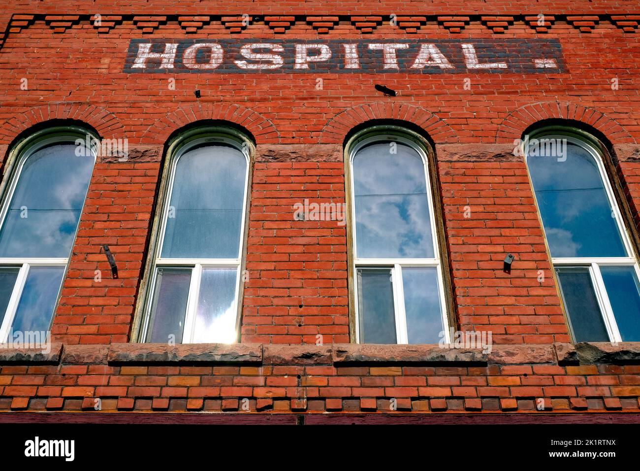 Old red brick hospital building in old town Stock Photo - Alamy