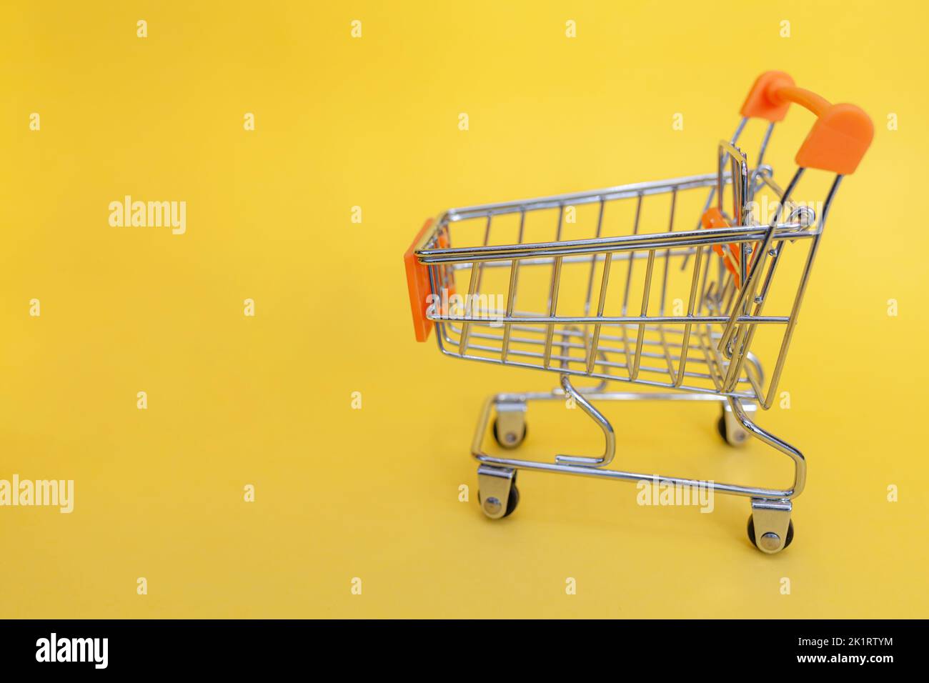 Small supermarket grocery push cart for shopping. Shopaholic Stock ...