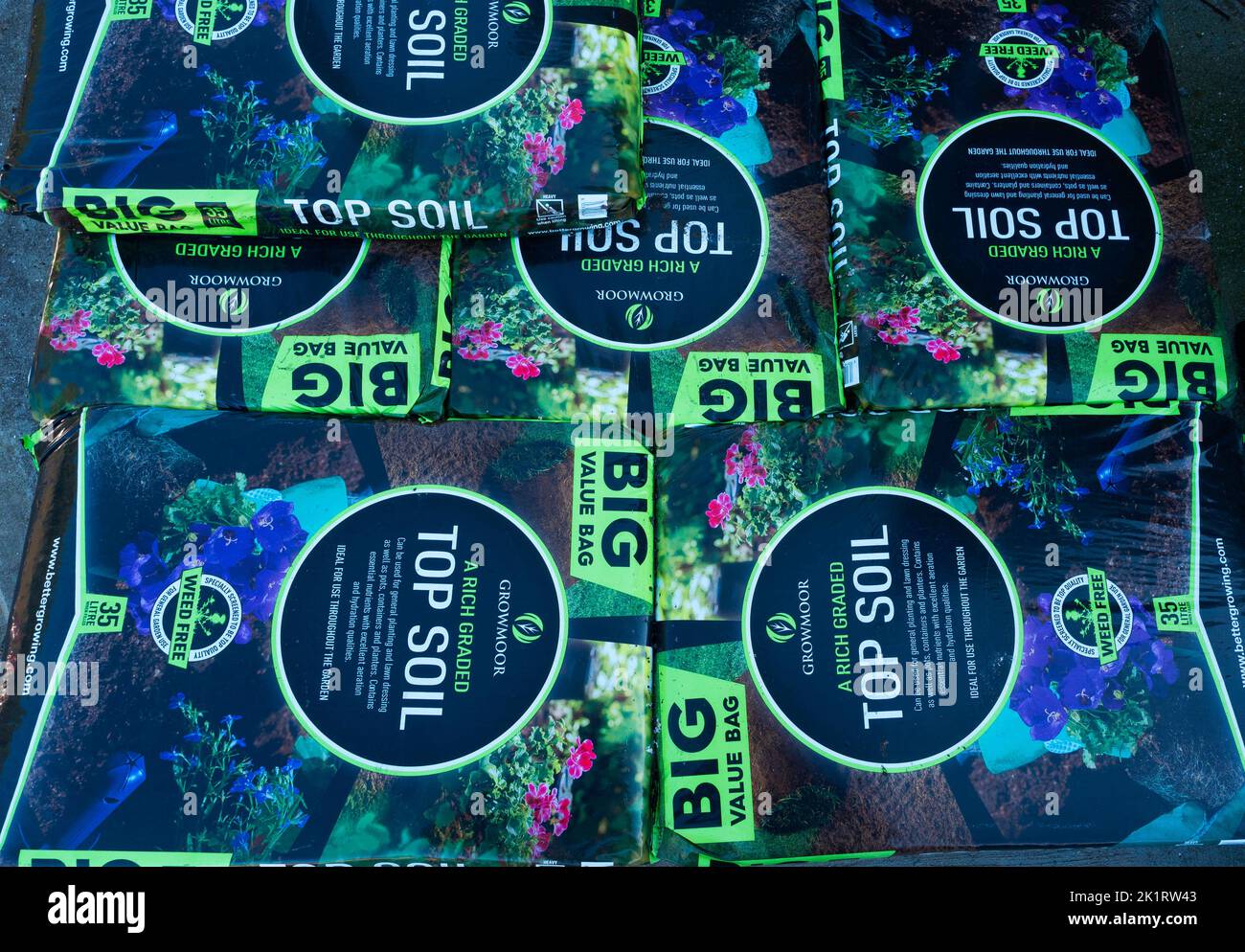 A stack of bags of Growmoor Top Soil in a farm shop Stock Photo - Alamy