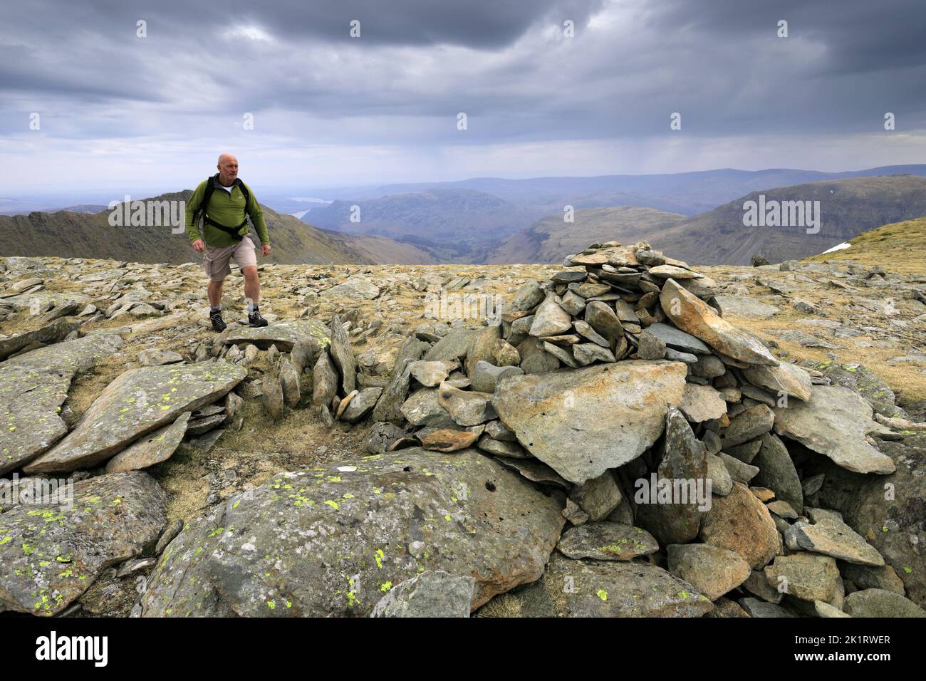 Walker at the summit of Nethermost Pike fell, Lake District National ...
