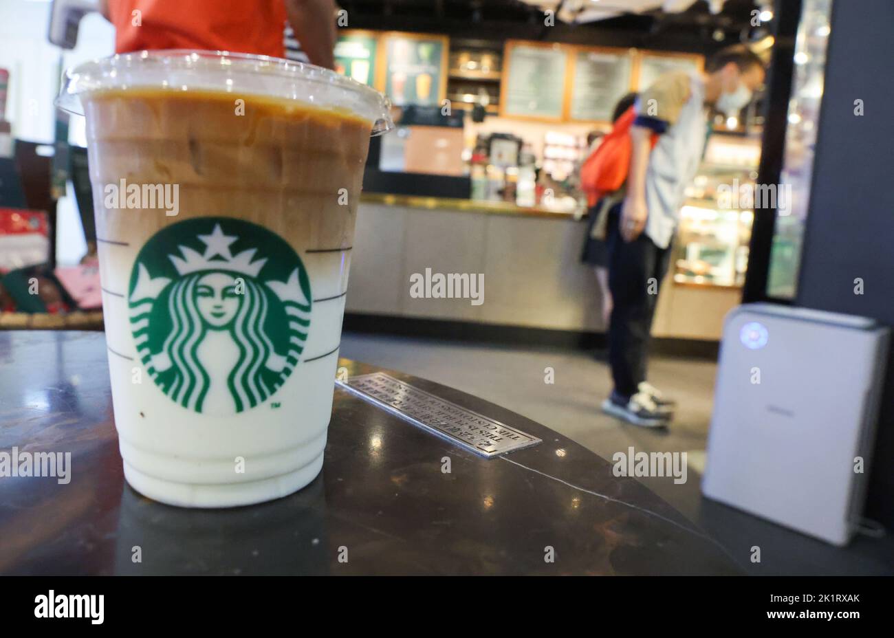 Interior of Starbucks branch at Times Square in Causeway Bay. Seven ...