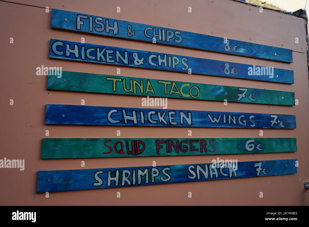 The menu of a small restaurant written in a creative way on colored ...