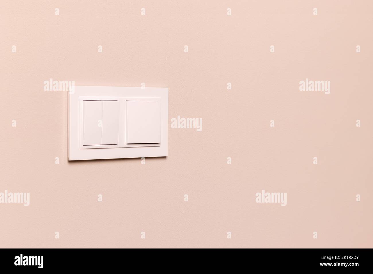Group of white electrical switches on modern beige wall Stock Photo - Alamy