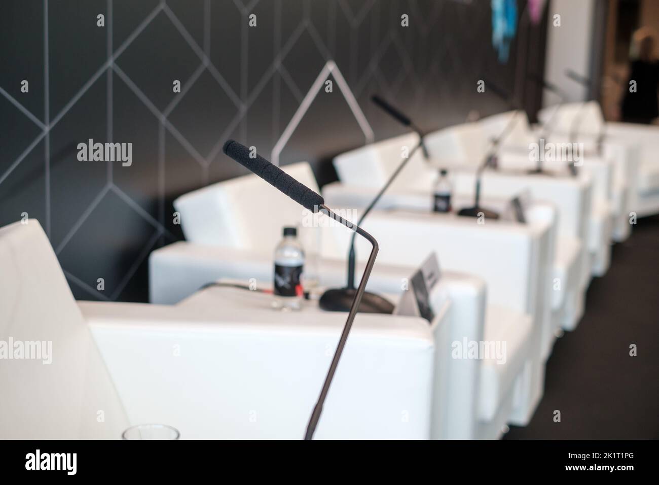 Table microphone standing on table at modern conference hall Stock ...