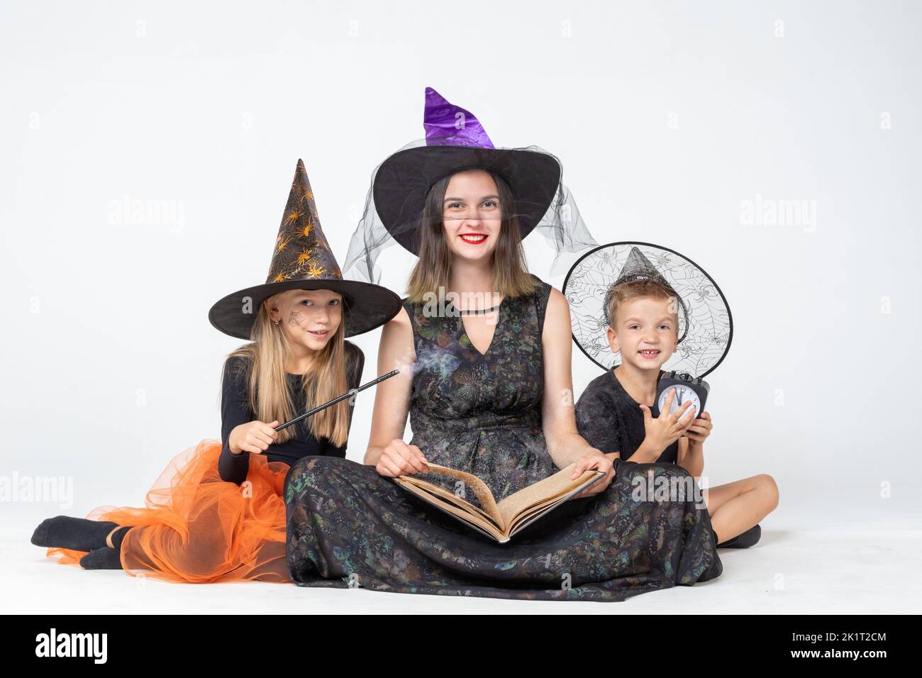 Family Halloween. A happy family in creepy costumes of witches and ...