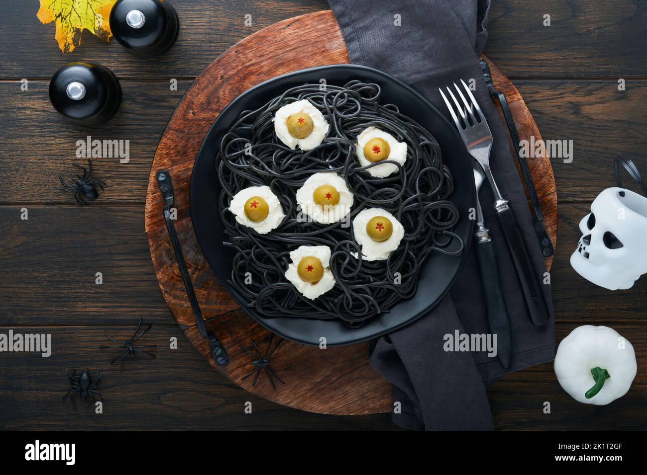 Halloween party Italian black pasta decorated horror olives like eyes ...