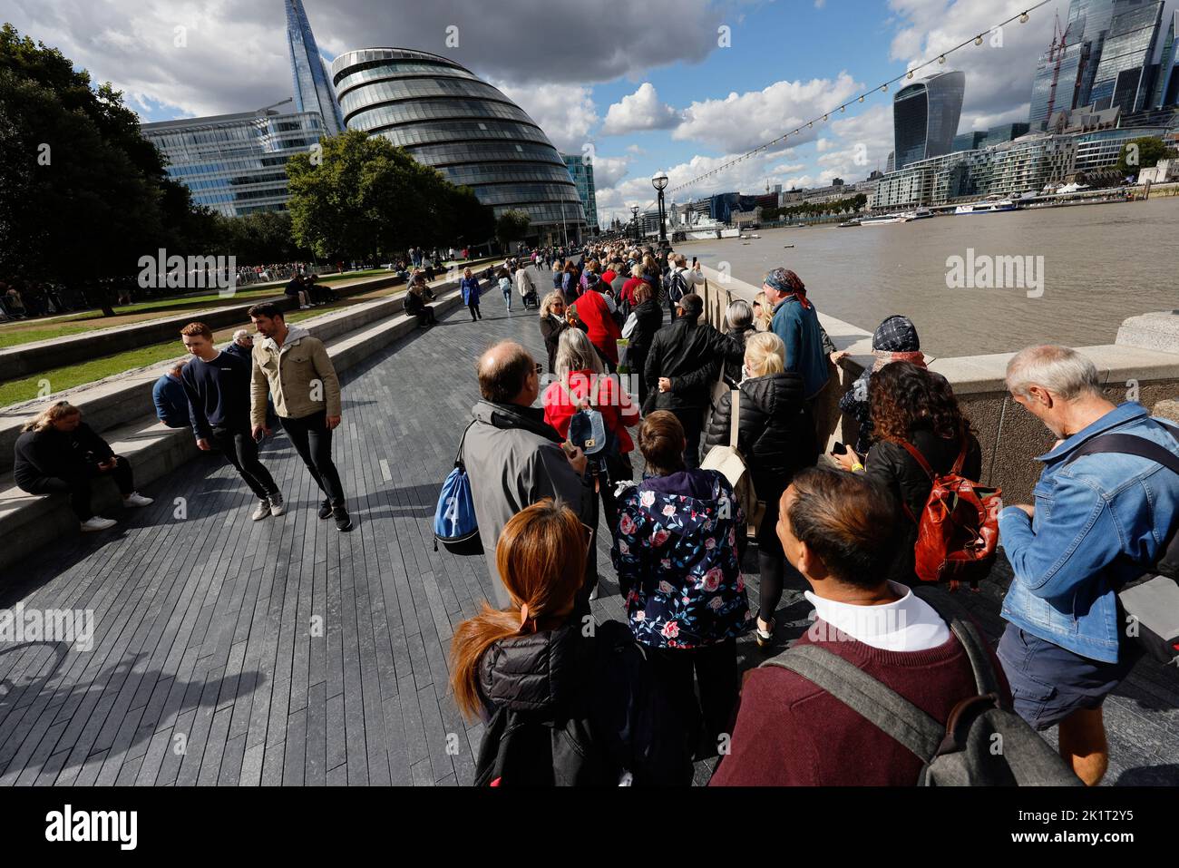 England, London, Mourners queueing along the banks of the river Thames ...