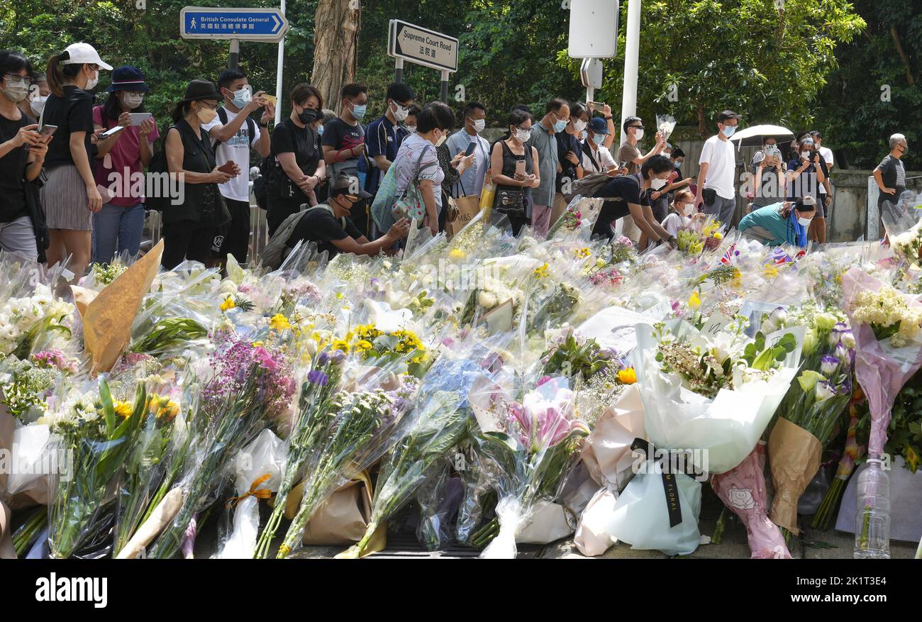 People queue up to pay floral tributes as Queen Elizabeth II's death is ...