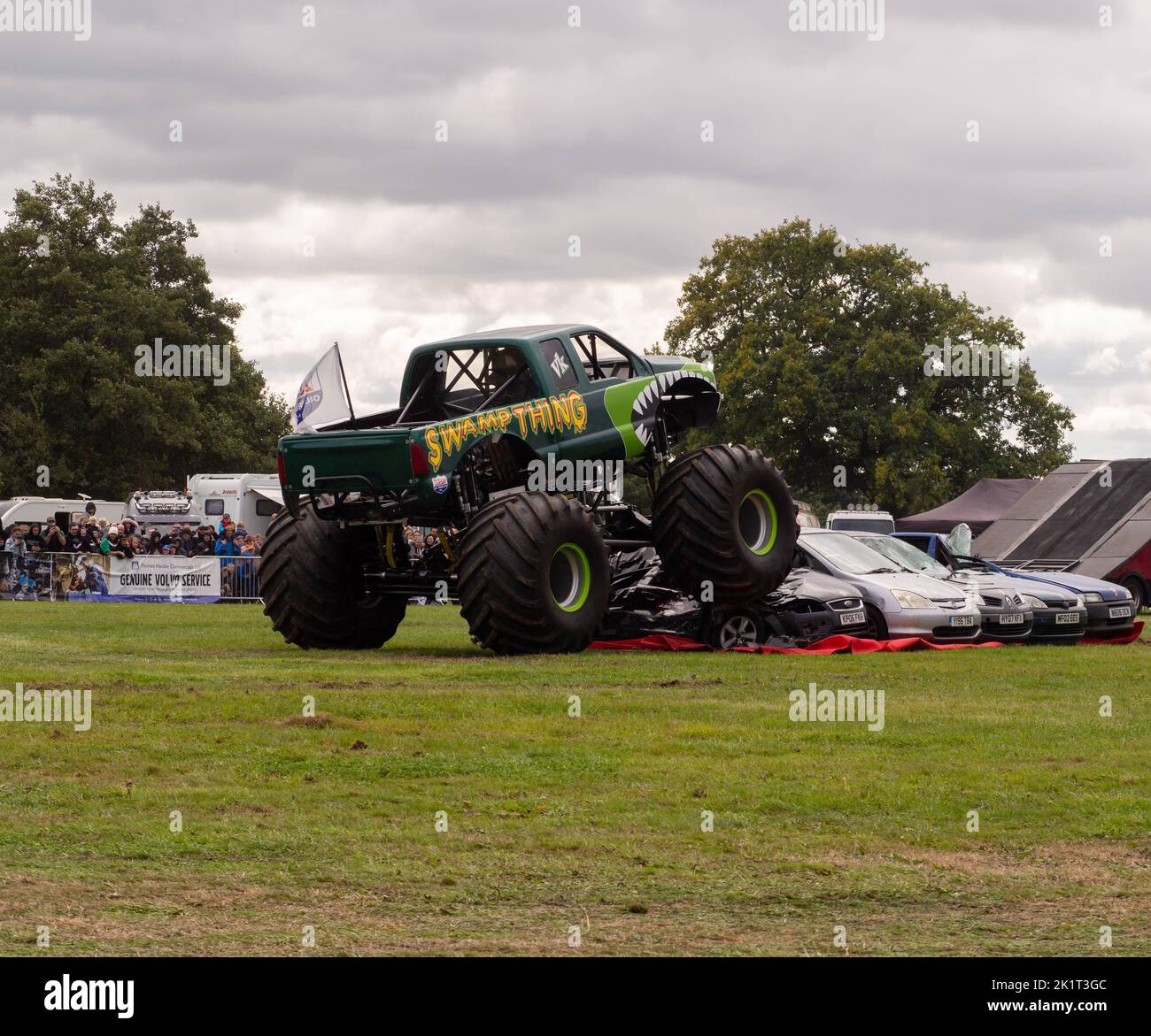 Swamp Thing Monster truck demonstrating its skills at leaping over cars ...