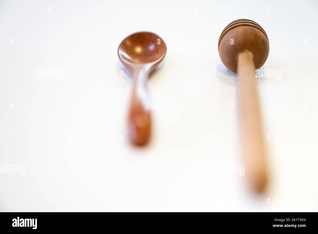 Wooden spoon and honey dipper on isolated white background Stock Photo ...