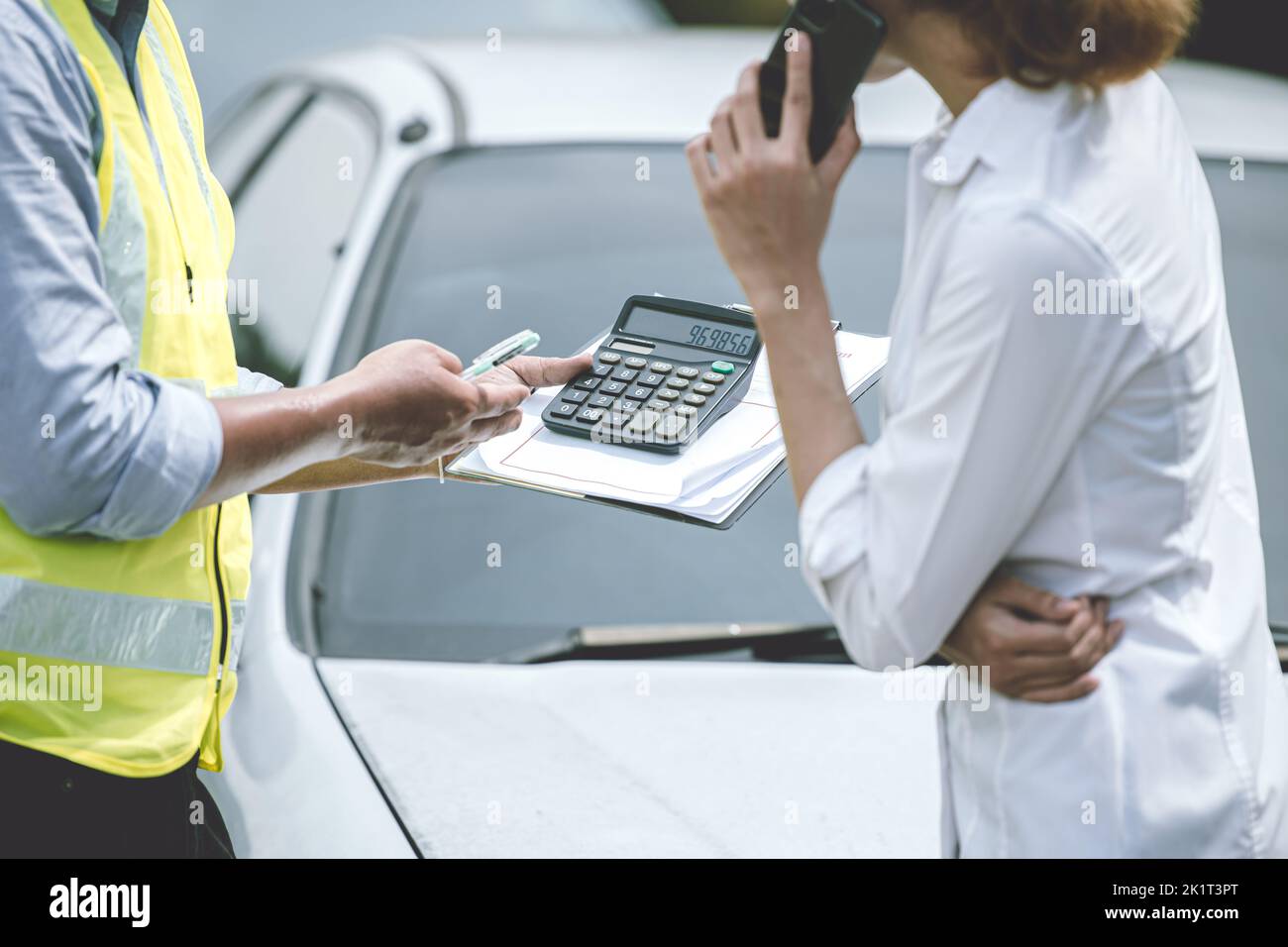 car claim agent officer showing service cost to women driver. lady buy ...