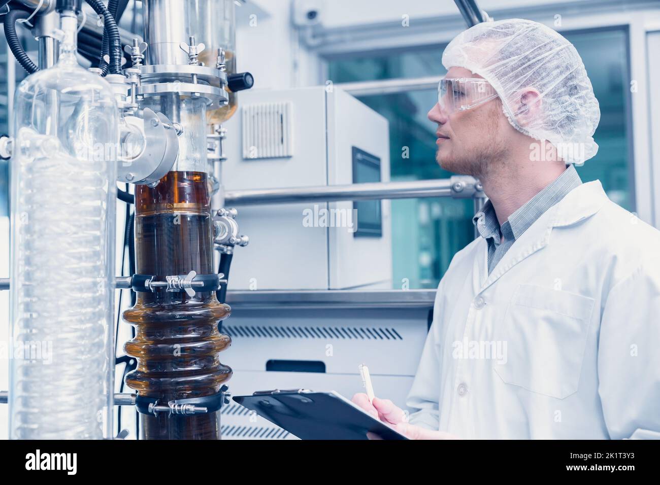 medicine factory scientist worker with Cannabis CBD oil extraction machine. Hemp oil extraction ...