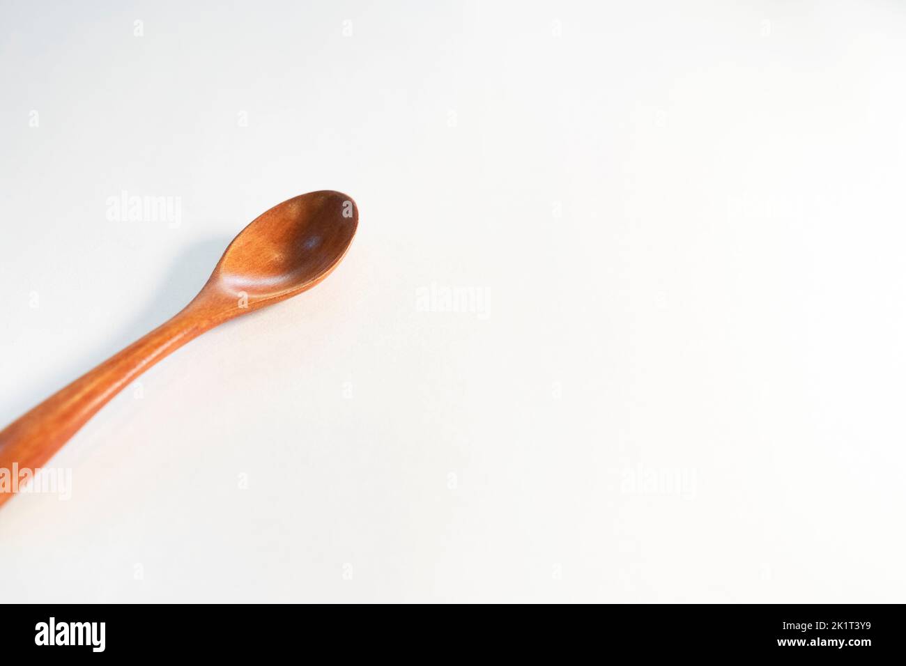 wooden spoon on isolated white background Stock Photo - Alamy