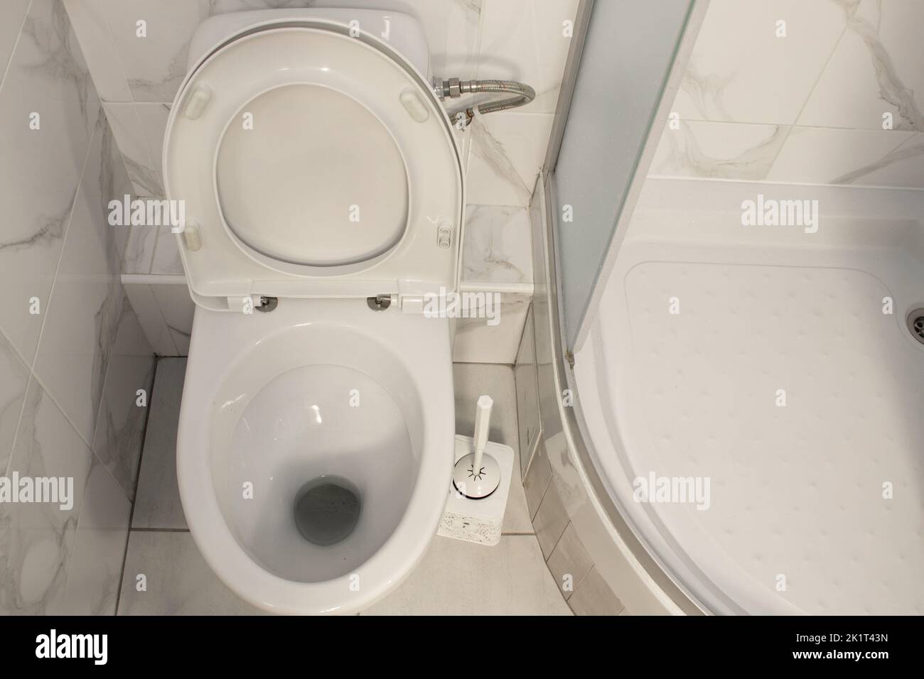 Toilet bowl and shower cabin in a residential apartment in Ukraine in ...