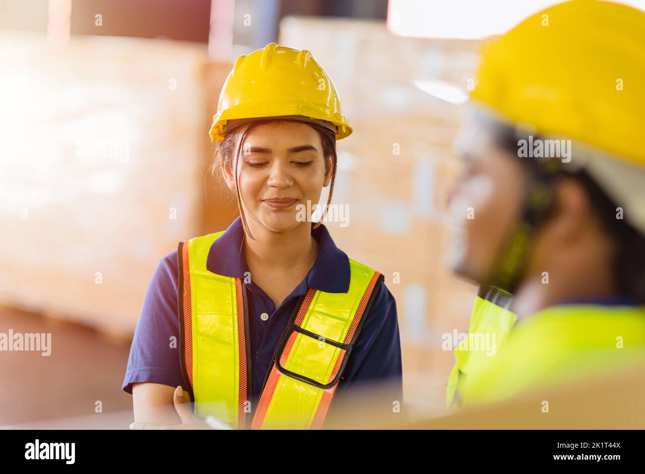 Industry cargo warehouse working woman work with male teamwork happy ...