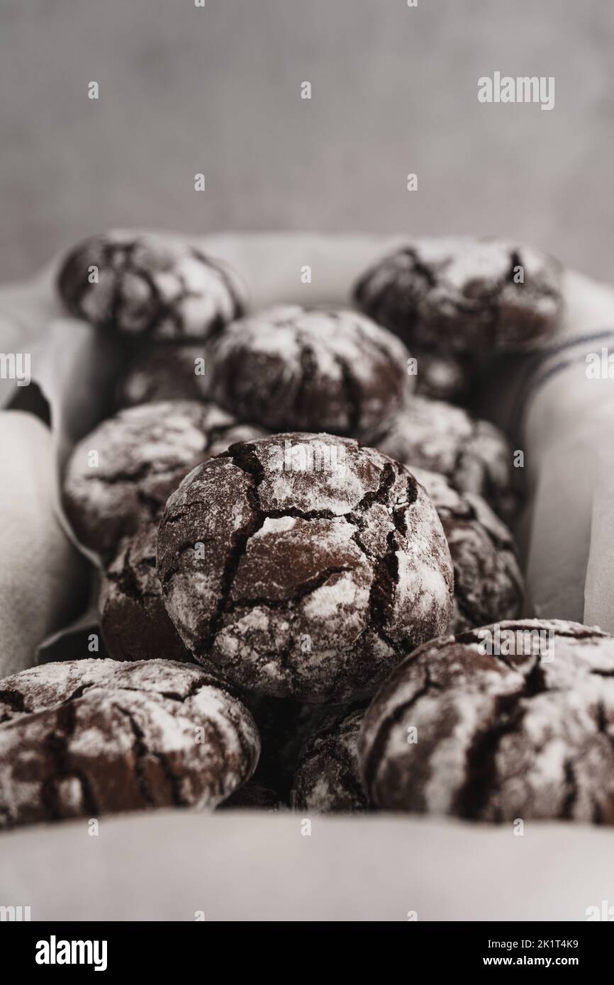Chocolate Crinkle iced biscuits arranged on a white marble kitchen work ...