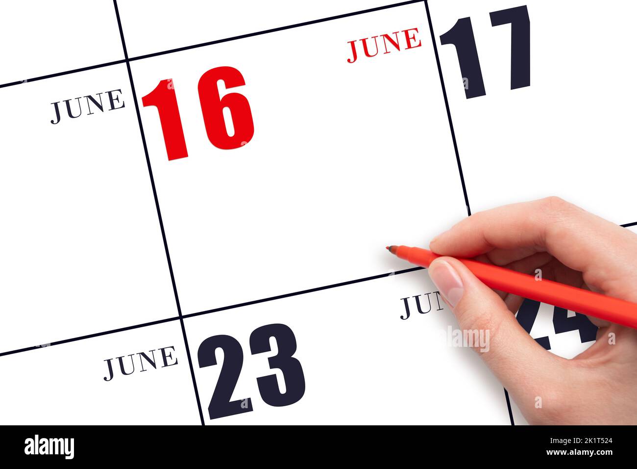 16th day of June. A hand holding a red pen and pointing on the calendar ...
