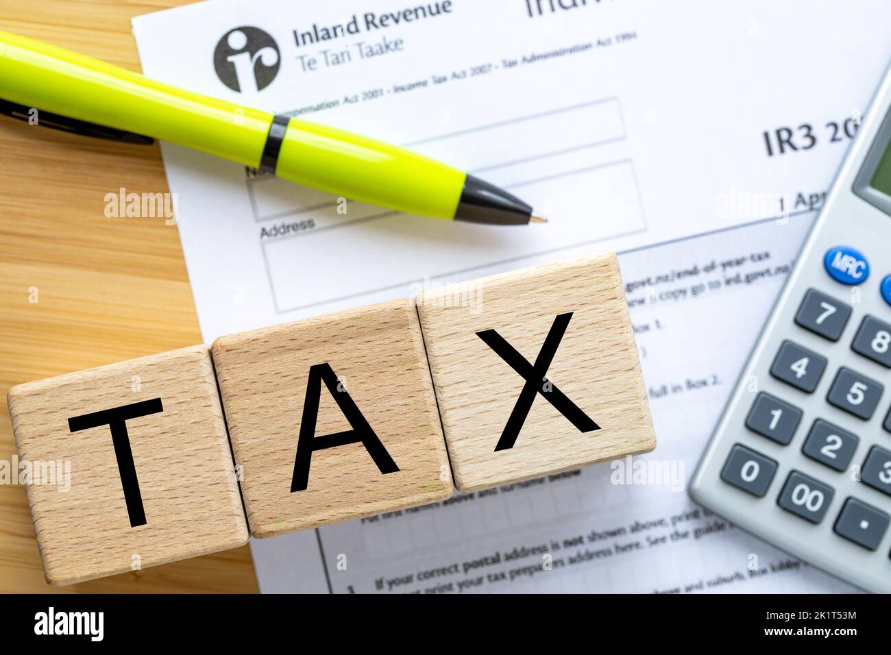 New Zealand tax return, Private form, Wooden blocks with the word Tax ...