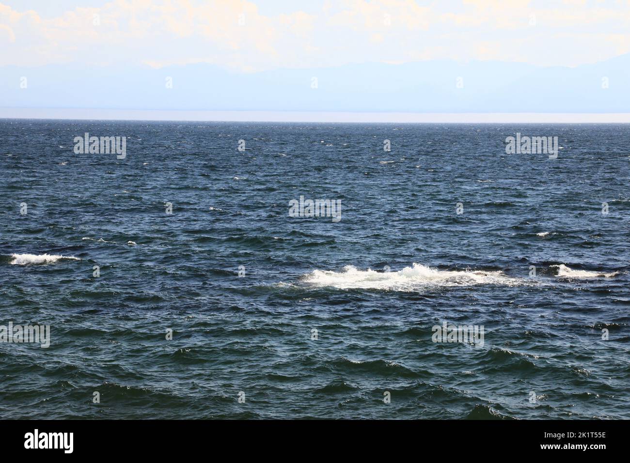 Low tide exposes hazardous rocks Stock Photo - Alamy