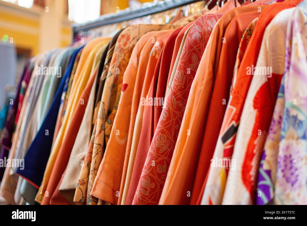 bright colourful vintage kimono on dress rail at vintage fair Stock ...