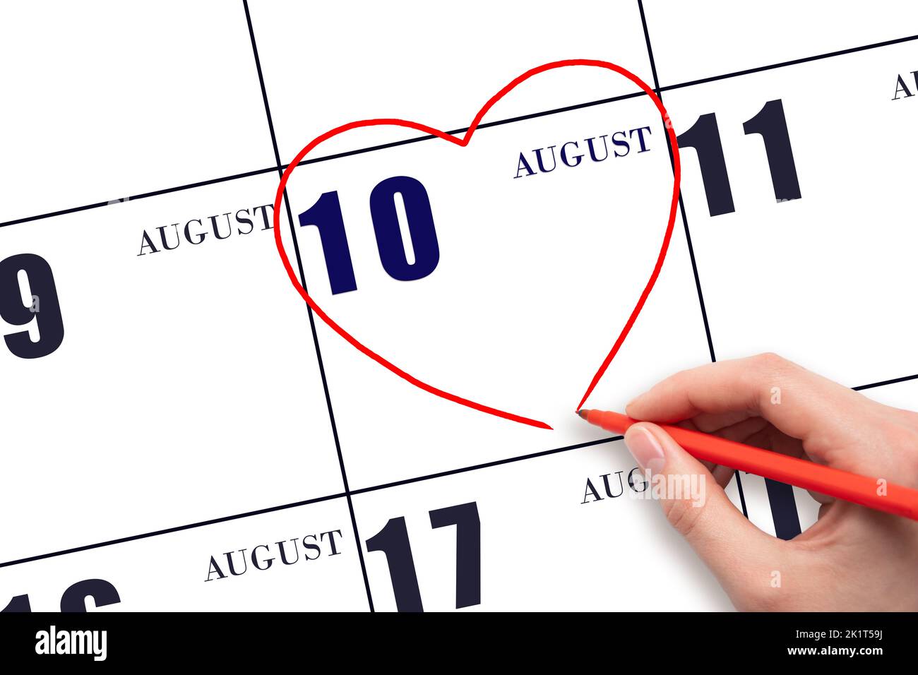 10th day of August. A woman's hand drawing a red heart shape on the ...