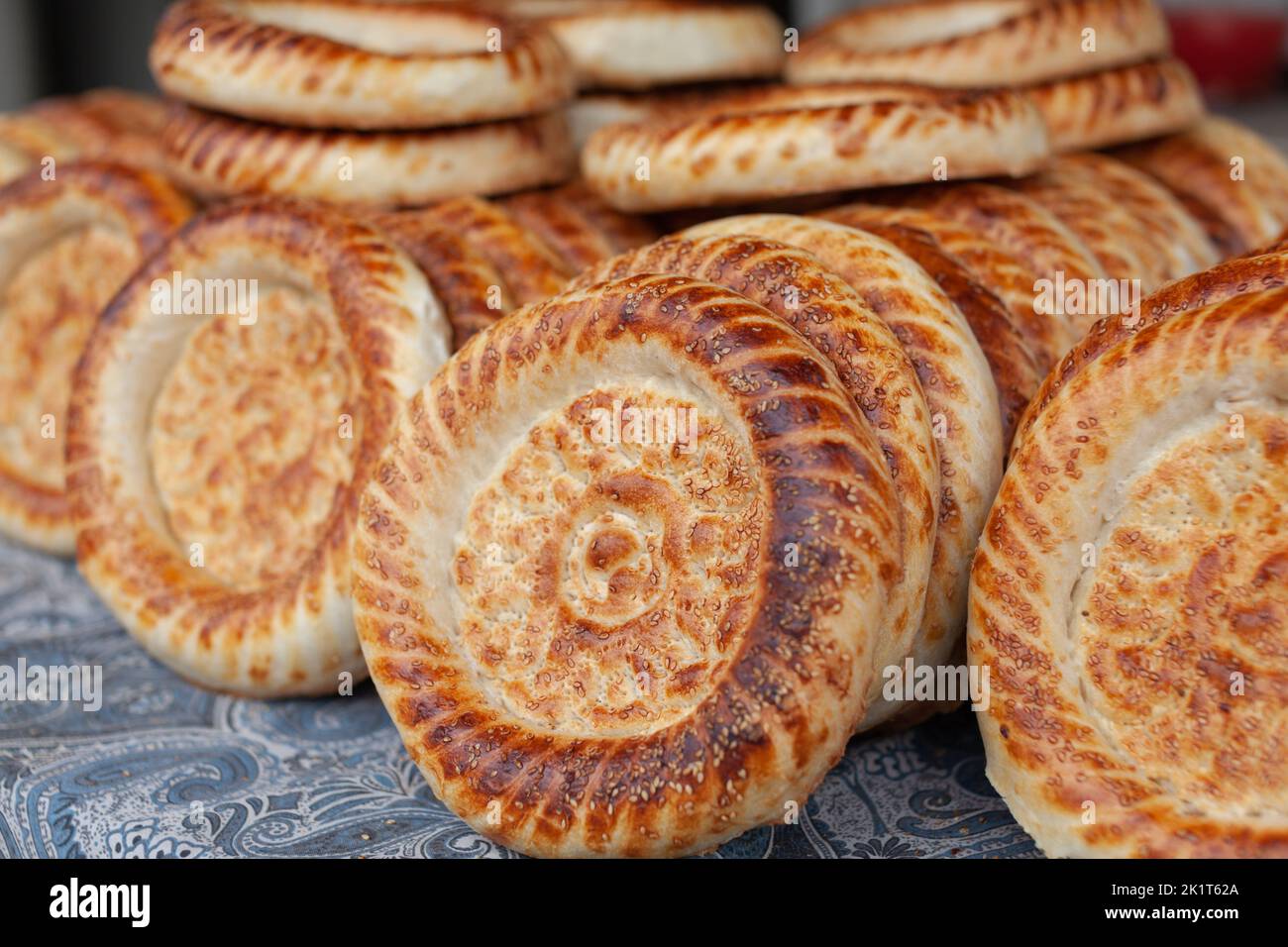 Typical traditional flatbread with crunchy crust with sesam just baked ...