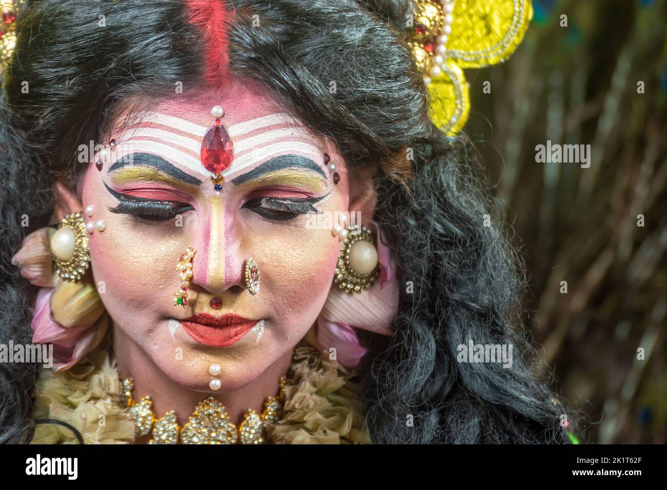 Concept Agomoni shoot with black haired Indian brunette woman face with ...