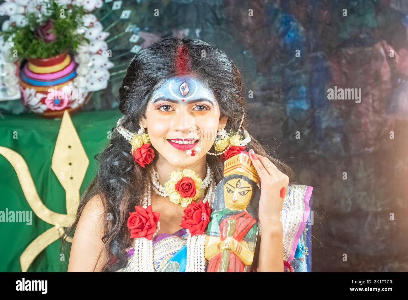 Concept Agomoni shoot with black haired Indian brunette woman face with ...