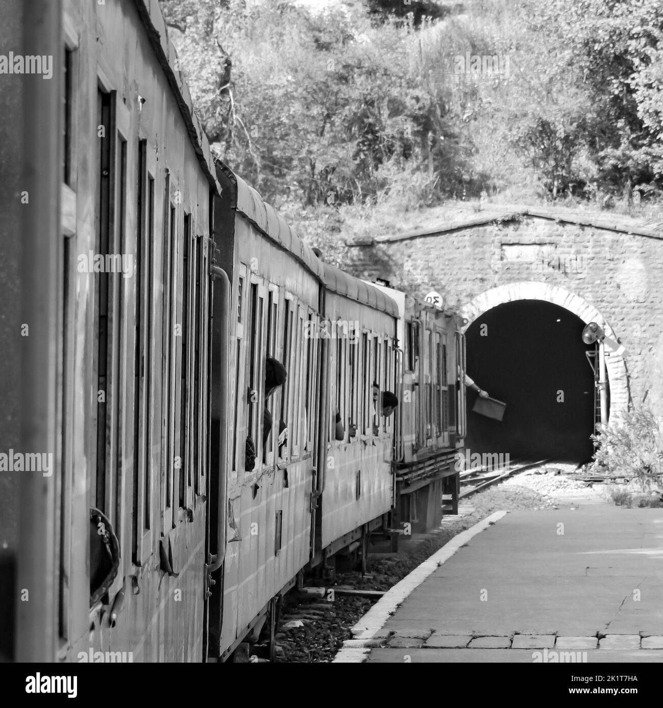 Toy Train moving on mountain slope, beautiful view, one side mountain ...