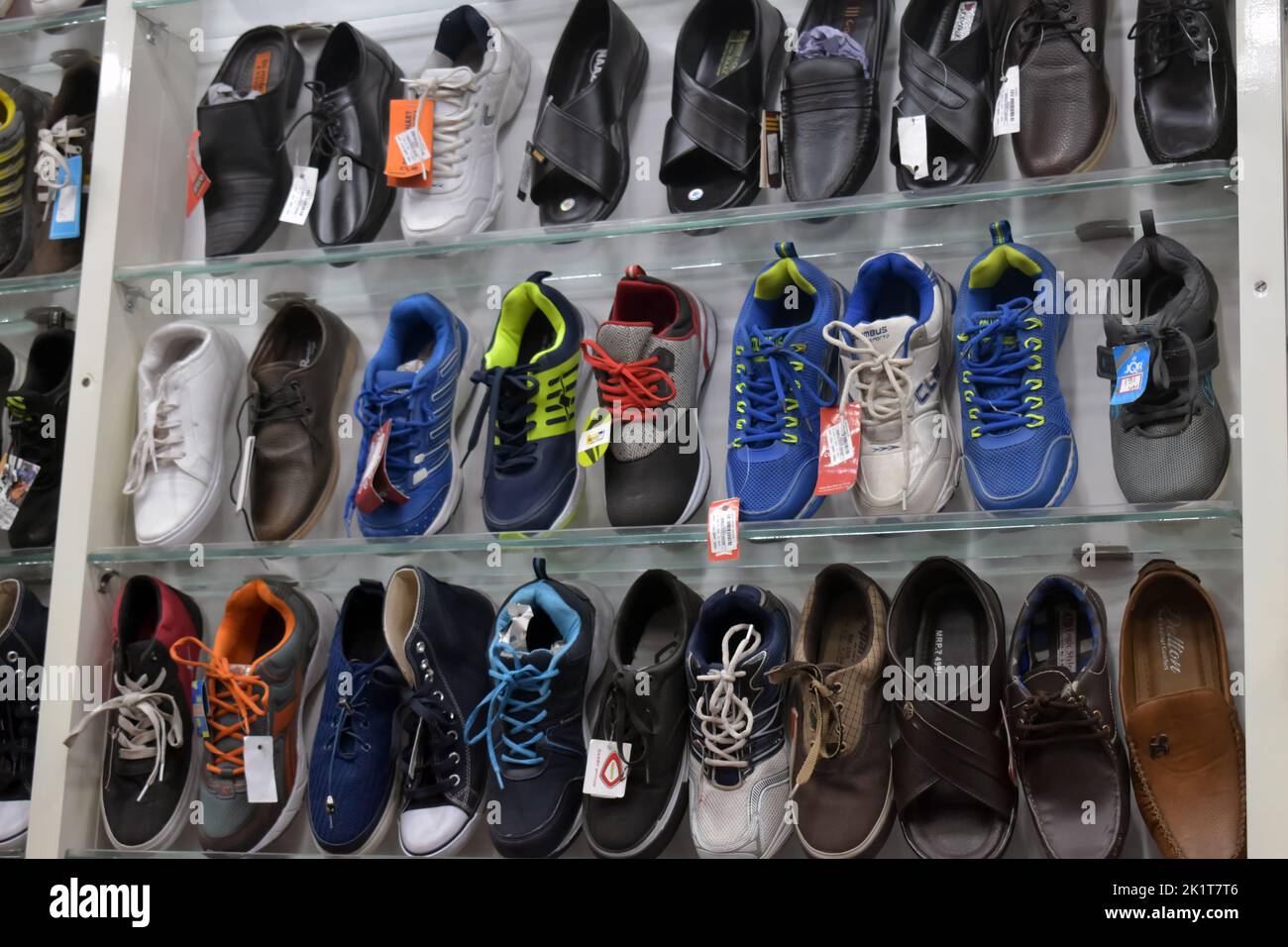 The retail display of colorful spots shoes at the street roadside ...